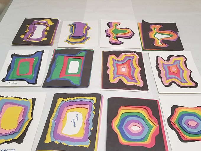 Colorful geometric designs burst from the page in these vibrant paper artworks, showcasing the diverse techniques taught in Art House workshops.