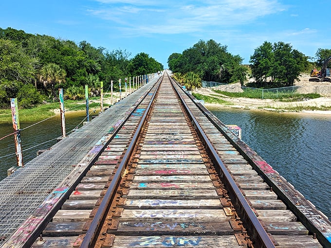 Railroad tracks stretch across the bridge, creating an unexpected gallery space where trains and art coexist peacefully.