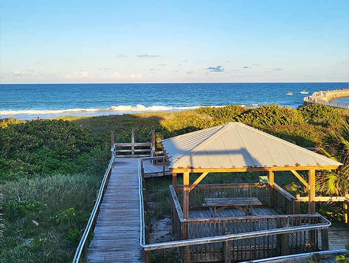 A wooden boardwalk leads to paradise &ndash; the kind of view that makes you forget your inbox exists.