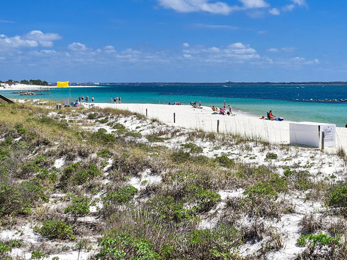 The shoreline stretches like nature's welcome mat, inviting visitors to kick off their shoes and forget about Monday's meeting for a while.