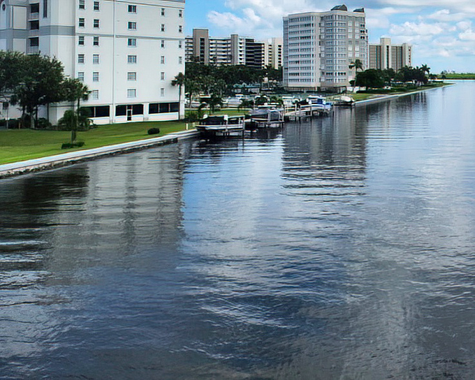 Waterfront living: Sleek condos line the calm canal waters, where boats bob gently &ndash; Florida's version of a driveway filled with toys.