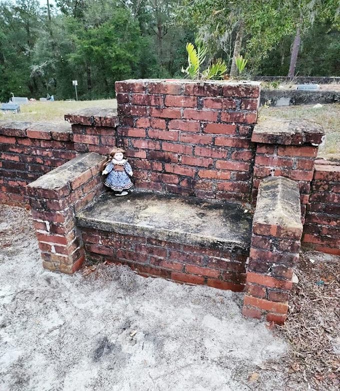 Just a simple brick chair in a cemetery, unless you believe the legends about midnight visitors and mysteriously empty beer cans.