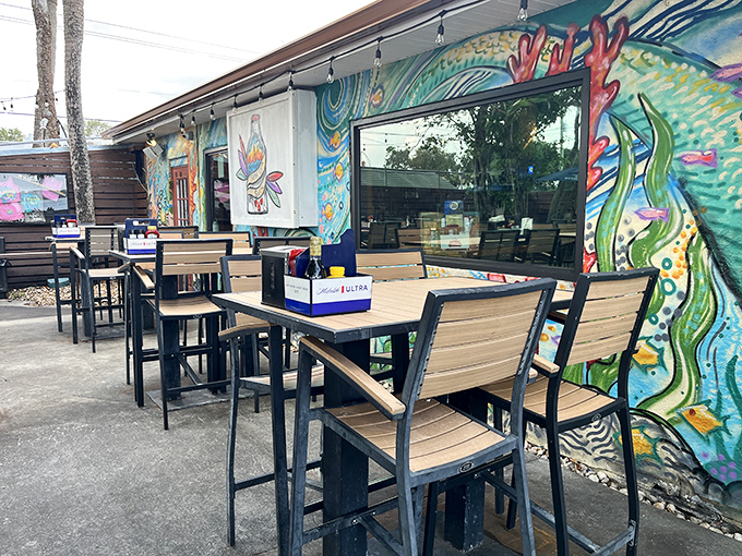 Colorful murals and wooden tables create a laid-back vibe at Pineda Inn, where riverside dining feels like Florida's best-kept secret.