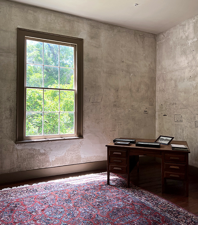 If this antique desk could talk... oh wait, the walls already do! Sunlight streams in, illuminating history's workspace.