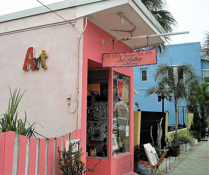 "A Little Room For Art" gallery brings splashes of color to the district, its pink facade as vibrant as the creativity inside.