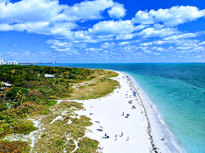 Powdery white sand meets impossibly blue water, creating the kind of beach day that makes snowbirds extend their stay indefinitely.
