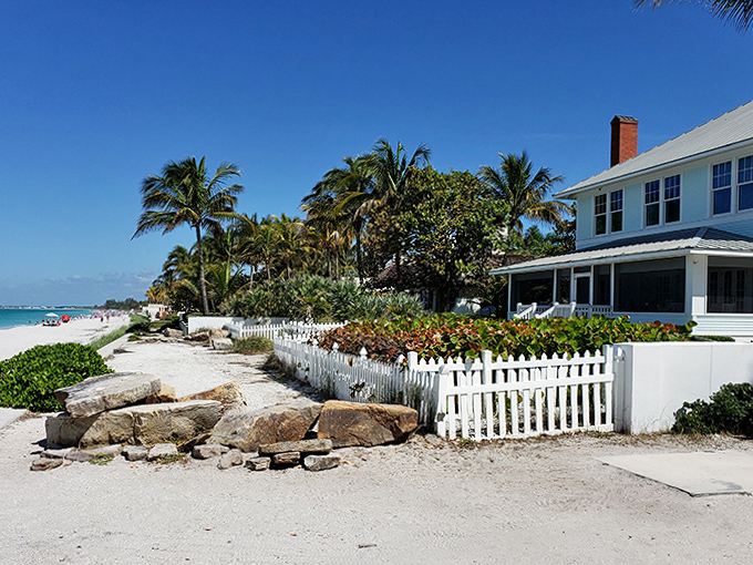 Classic Florida charm lives on in Boca Grande's beachfront cottages, where white picket fences frame postcard-perfect views of the Gulf.