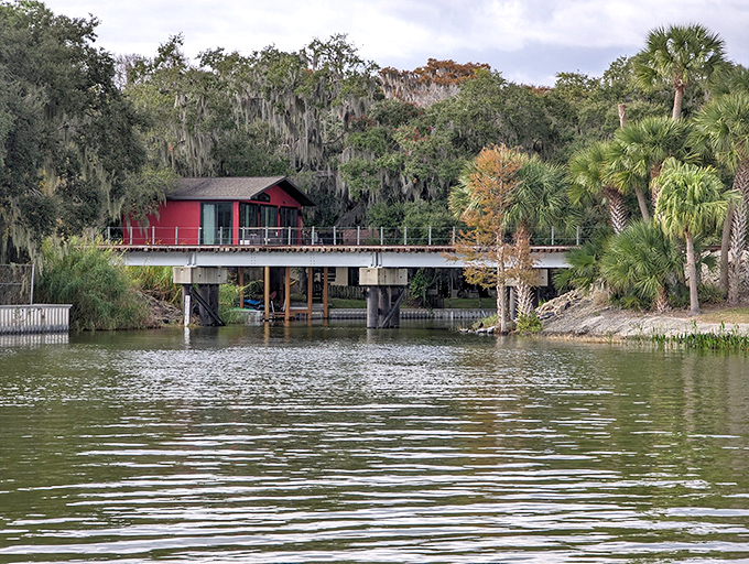 This charming red-roofed structure bridges the gap between civilization and wilderness, offering canal travelers a momentary connection to the human world.