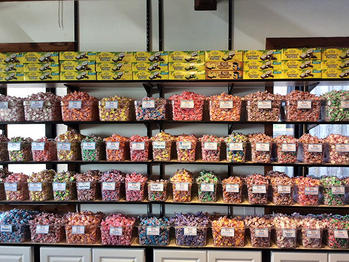 Rows of handcrafted chocolates gleam like edible jewelry, each piece a tiny masterpiece waiting to melt on your tongue.