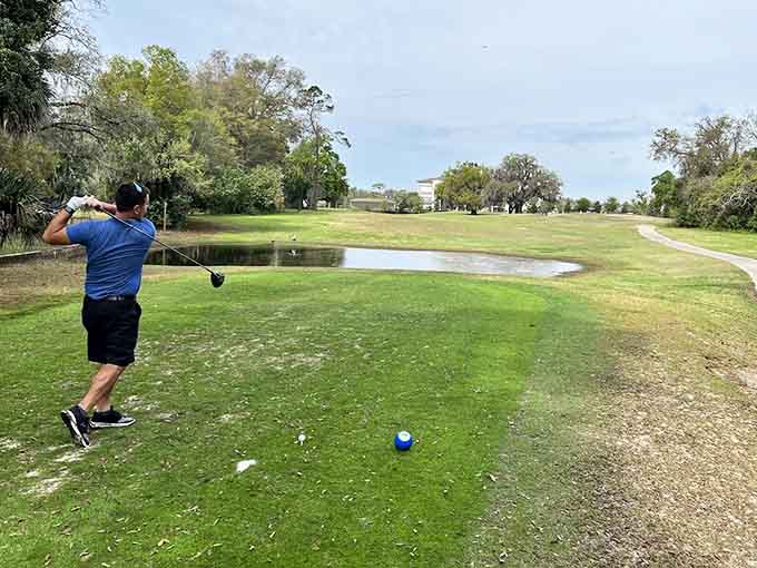 Mid-swing magic captured against a backdrop of Florida greenery, proof that some moments are worth more than whatever ends up on the scorecard.