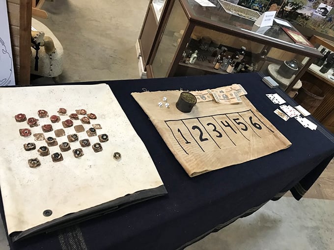 Simple wooden game boards showcase how pioneers passed time without electricity &ndash; checkers and betting games never needed batteries!