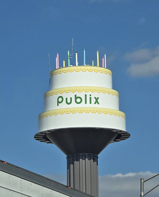 Up close, the tower's meticulous details shine &ndash; from the scalloped yellow trim to the bold green Publix lettering that pops against the white "frosting."