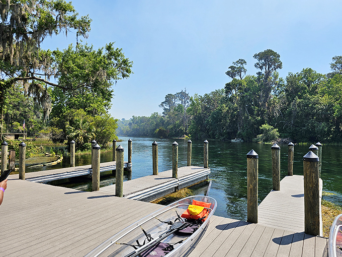 The dock area provides easy access to the crystal-clear water, where launching a kayak feels less like starting an adventure and more like stepping into a postcard come to life.