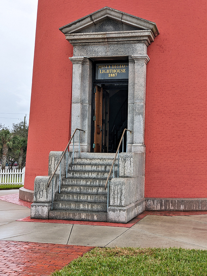 The grand entrance beckons visitors with its granite steps and historic plaque &ndash; your gateway to maritime history and breathtaking vistas.