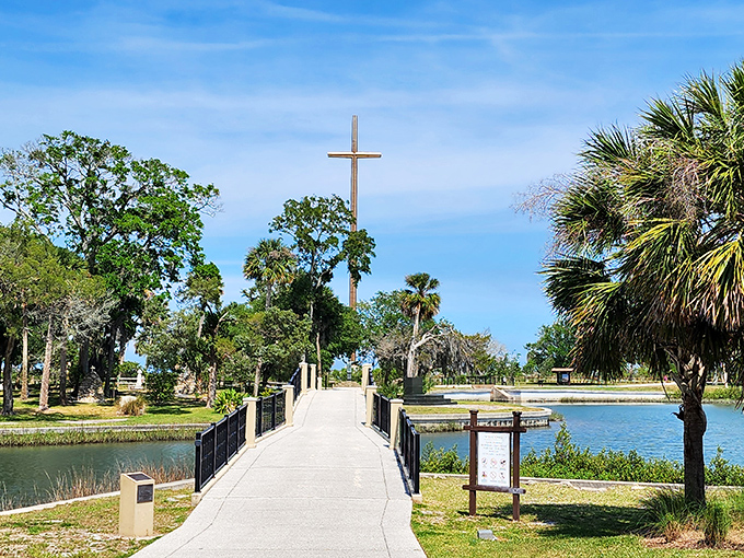 The pathway to enlightenment? Maybe just to an amazing photo op. This serene footbridge leads visitors across tranquil waters toward Florida's tallest cross.