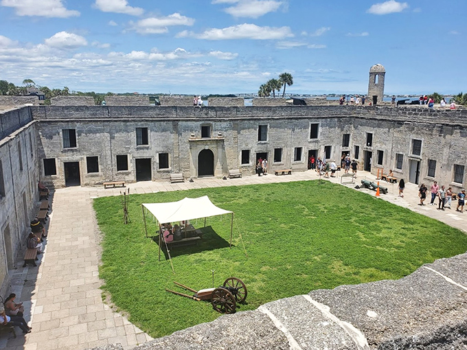 Within these walls, soldiers once drilled in formation where tourists now stroll, the courtyard serving as the fort's bustling heart.