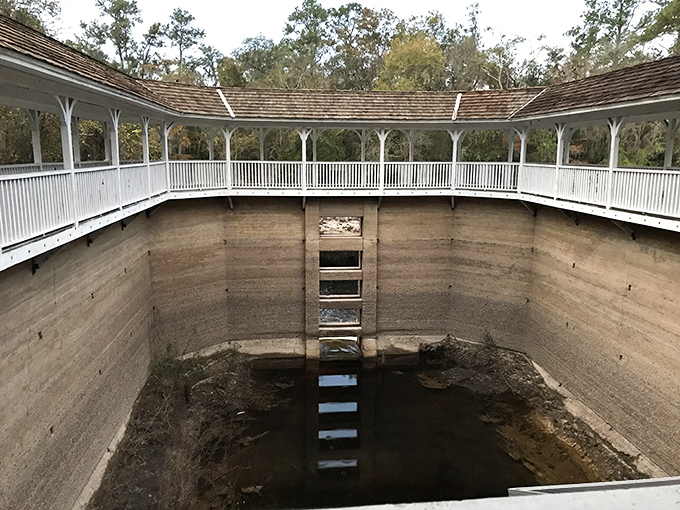 Peering down into the once-bustling spring chamber reveals the impressive depth of this early 20th-century construction, now mostly dry but still architecturally stunning.