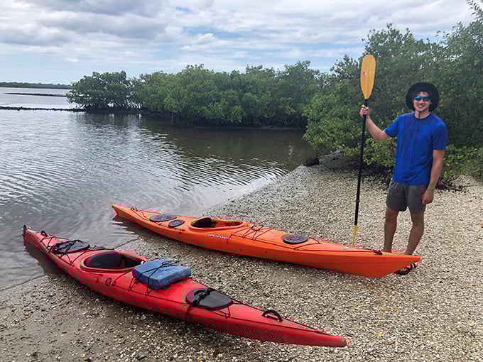 Kayaking enthusiasts prepare for an unforgettable journey through the lagoon's waters, where each paddle stroke will soon create trails of living light.