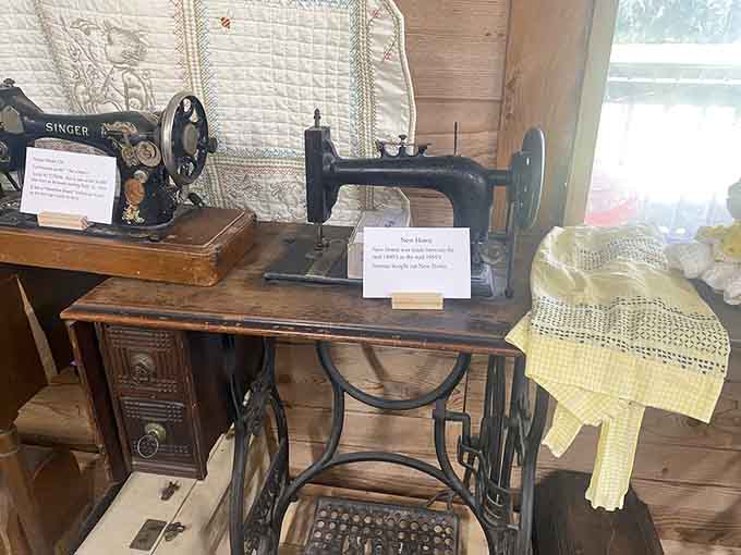 Vintage treadle sewing machines stand ready, proving that leg day meant something completely different to our ancestors.