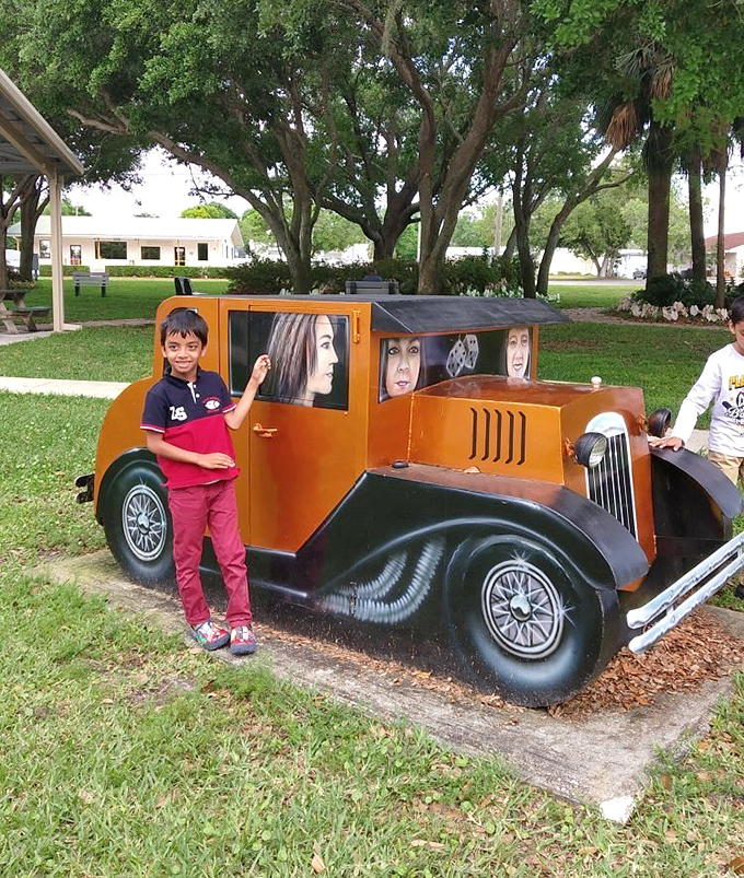 Model T Photo Op Mural Kids discover vintage cool at this interactive display where yesterday's wheels become today's Instagram moment.