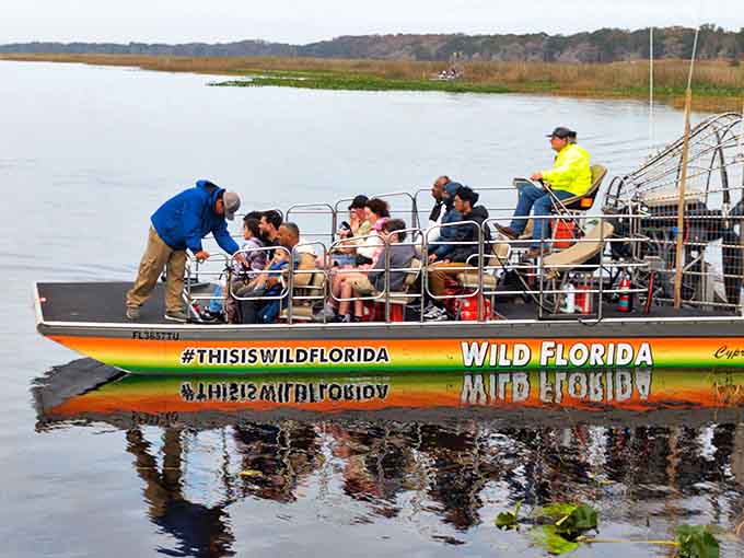 Passengers listen intently as their captain shares secrets of the wetlands &ndash; that smile on the left says it all: nature beats rollercoasters.