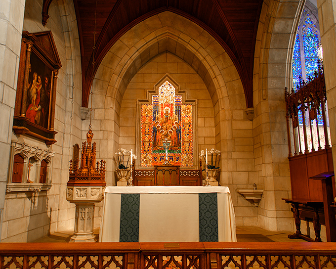 The altar's intricate craftsmanship tells stories in stone and wood, a masterpiece where medieval artistry meets spiritual devotion in vibrant color.