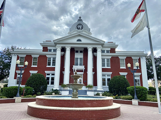 The majestic Pasco County Courthouse stands proud with its classical columns and red brick fa&ccedil;ade, a testament to enduring civic pride.