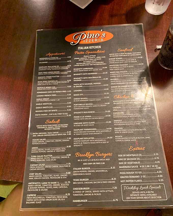 The menu at Pino's offers Italian classics beyond pizza, though let's be honest about why you're really here.