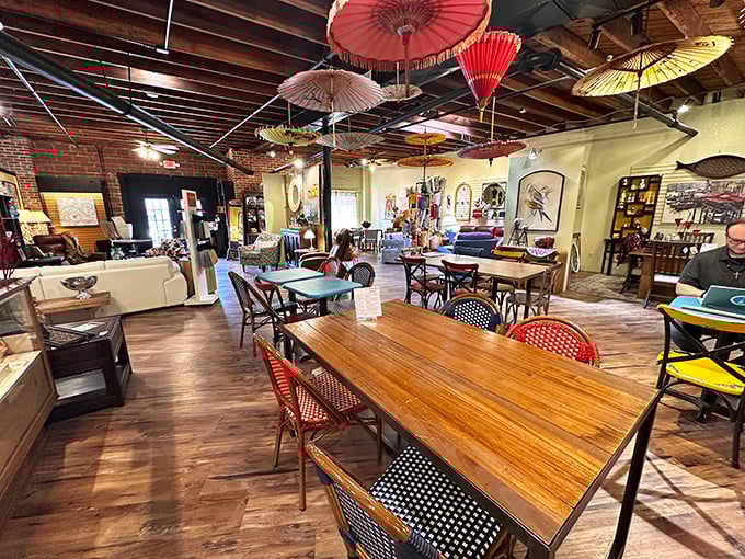Colorful parasols dance overhead at Poppy's, where mismatched tables and wooden floors create the perfect backdrop for Southern comfort food.
