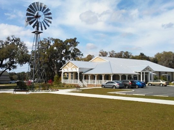 The Public Library combines rustic charm with modern purpose, complete with a windmill that seems to turn pages of history.