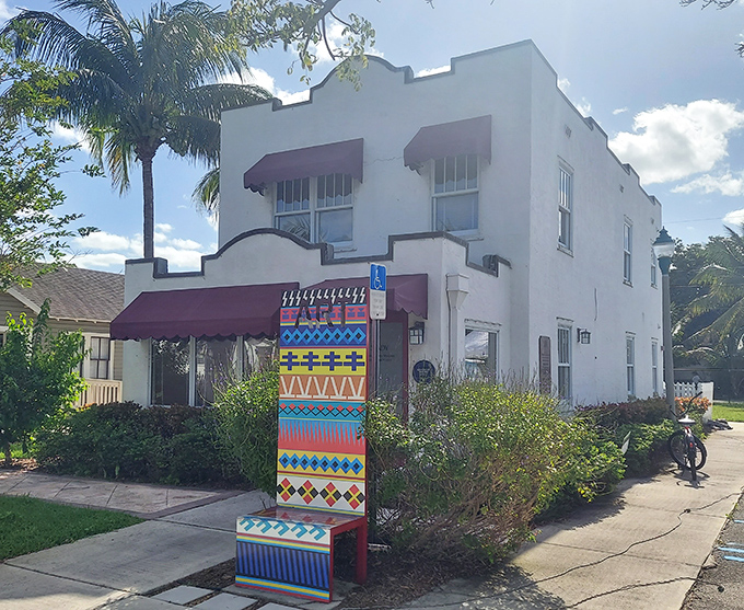 The Spady Cultural Heritage Museum preserves African-American history in a charming white building adorned with colorful artistic touches.