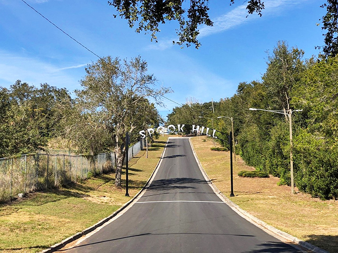 Looking up Spook Hill's mysterious slope where vehicles appear to roll uphill in neutral, challenging visitors' perception and sparking wonder.