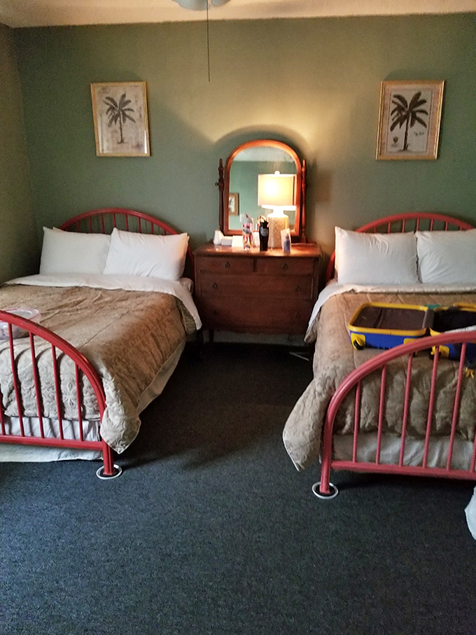 Two beds, perfect for those who don't want to face potential paranormal activity alone. The palm tree artwork seems cheerful enough, but wait until nightfall.
