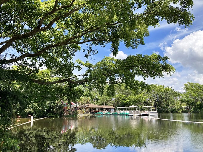 Tranquil waters reflect the lush landscape at Safari World, where boat rides offer a different perspective on wildlife viewing.