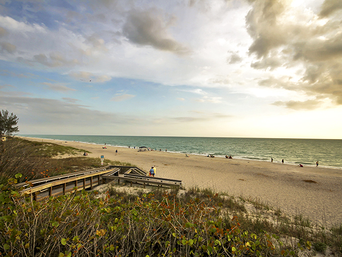 Golden hour transforms this quiet stretch of paradise into a canvas of amber light, where worries dissolve into the horizon.