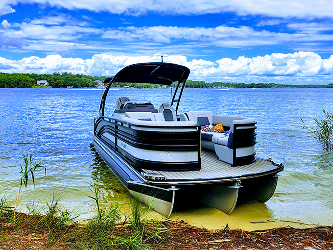 Weekend captain or first-time sailor? This sleek pontoon promises adventures on Rocky Bayou's glass-like waters.