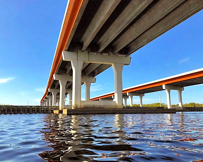 The elevated highway stretches across the Florida landscape, a modern marvel built atop layers of history and, some say, restless spirits.