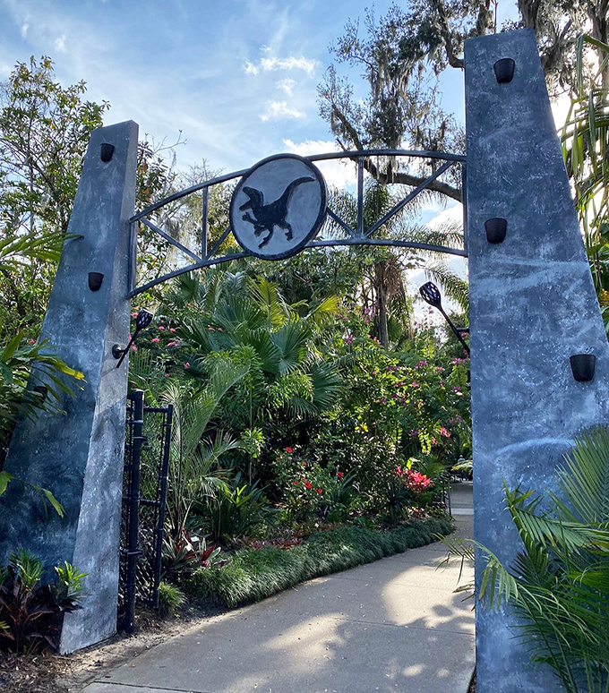 The entrance to Jurassic adventure! These stone gates promise a journey where botanical beauty meets prehistoric wonder.