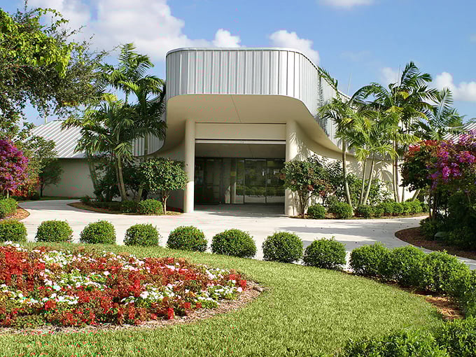 The modern entrance building stands like a portal between ordinary life and the extraordinary butterfly realm within.