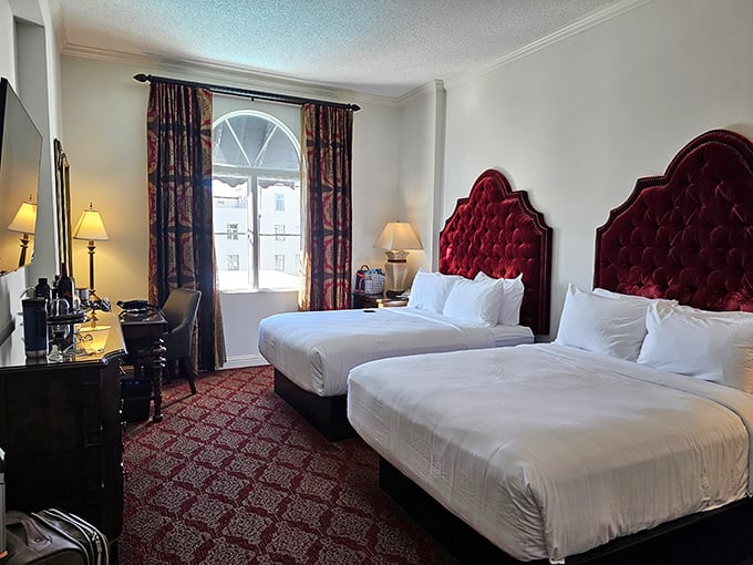 Crimson velvet headboards reign over cloud-like beds in guest rooms that strike the perfect balance between exotic luxury and "kick off your shoes" comfort.