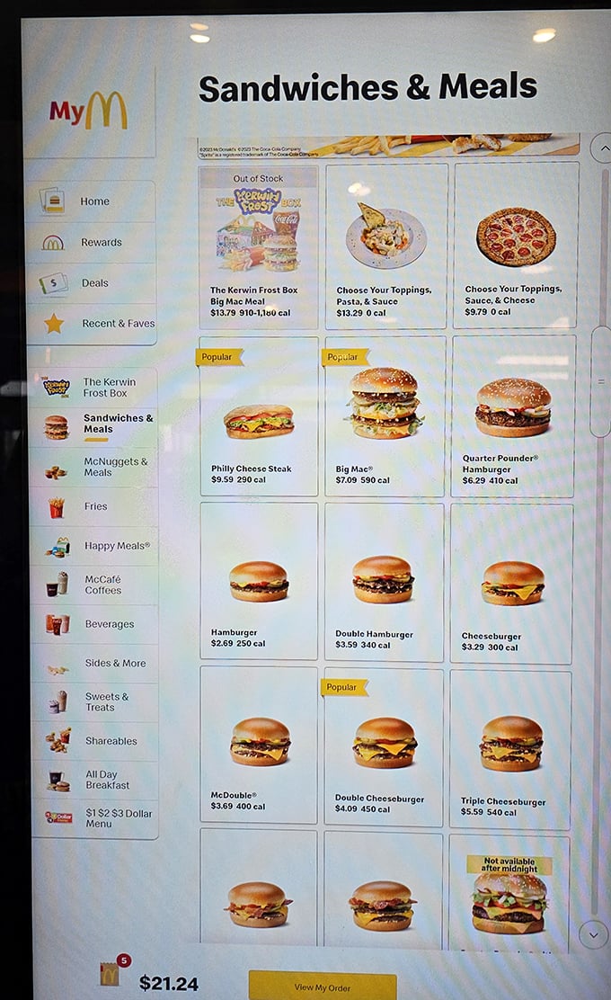 Digital menu boards reveal the first hint of something special – pasta and pizza options hiding among familiar McDonald's classics.