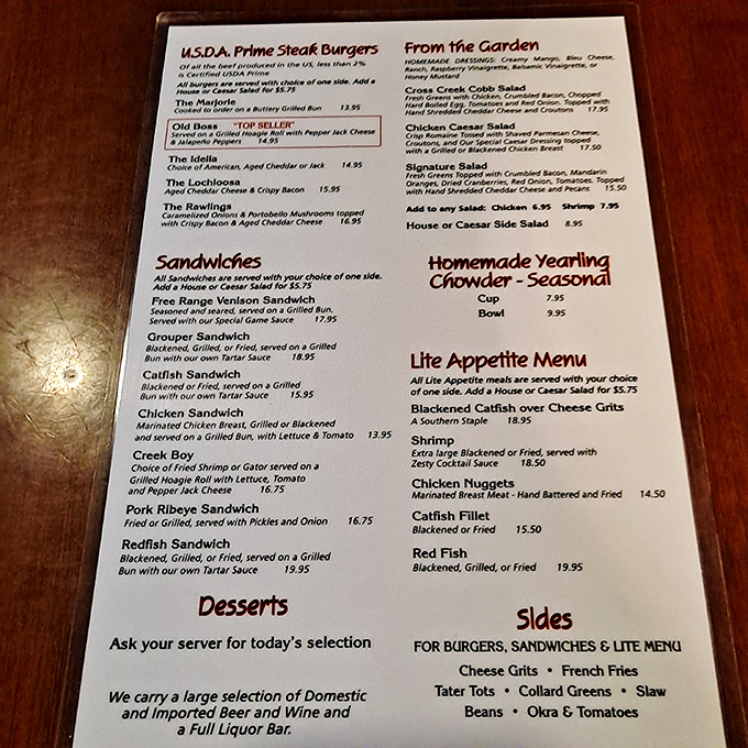 The menu reads like a love letter to Southern cuisine, featuring venison steaks, frog legs, and other wild game prepared with time-honored techniques.