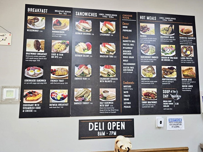 The menu board showcases an impressive array of German specialties, from breakfast items to hot meals, proving this isn't just another sandwich shop.