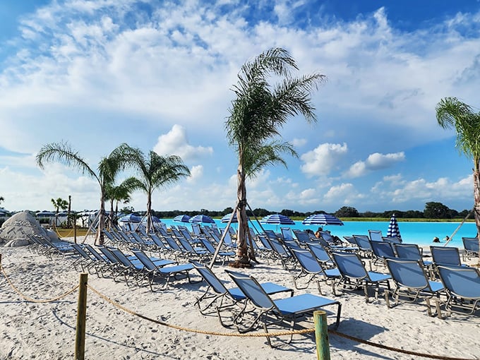 Blue lounge chairs await sunbathers like a welcoming committee for your vitamin D deficiency.
