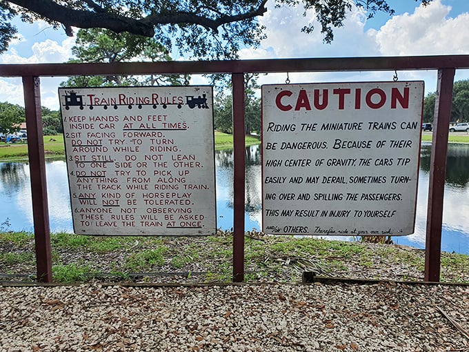 Warning signs that are almost as entertaining as the ride itself. Who knew tiny trains could have such dramatic safety concerns? Proceed with caution and a smile!