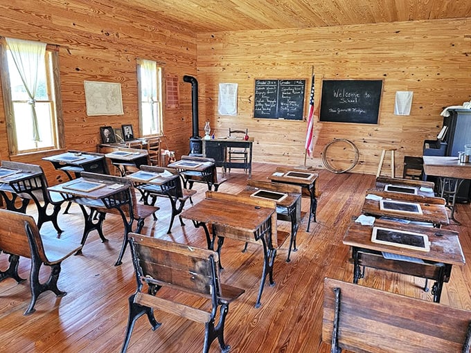 Rows of wooden desks await phantom students in this one-room schoolhouse, where education was a privilege, not a right.