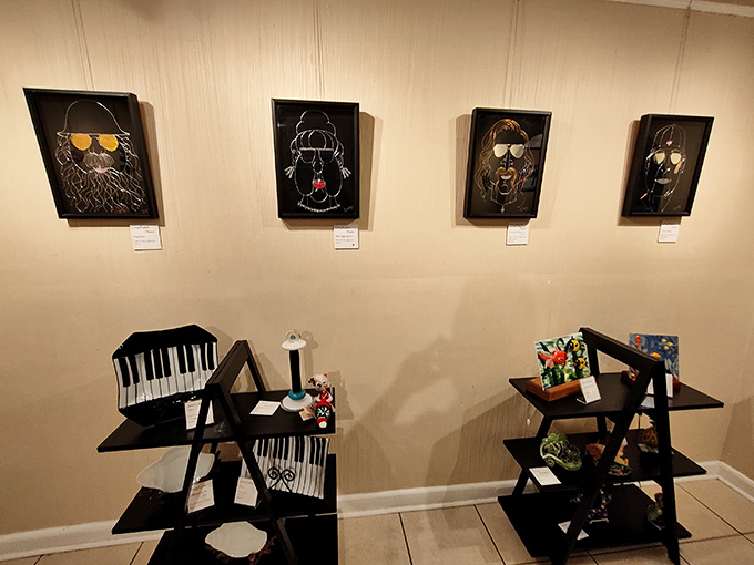 Contemporary portraits with sunglasses add a touch of whimsy to the gallery walls, while piano-themed display shelves below showcase smaller treasures.