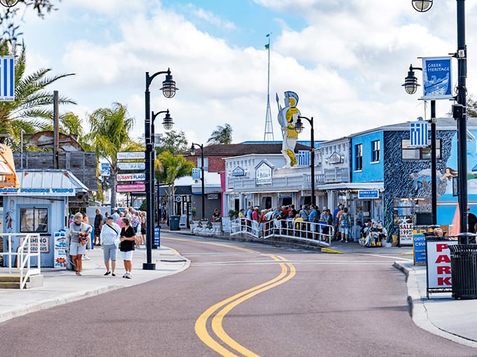 Tarpon Springs' vibrant colors welcomes visitors with blue and white Greek flags, authentic restaurants, and a lively Mediterranean atmosphere.