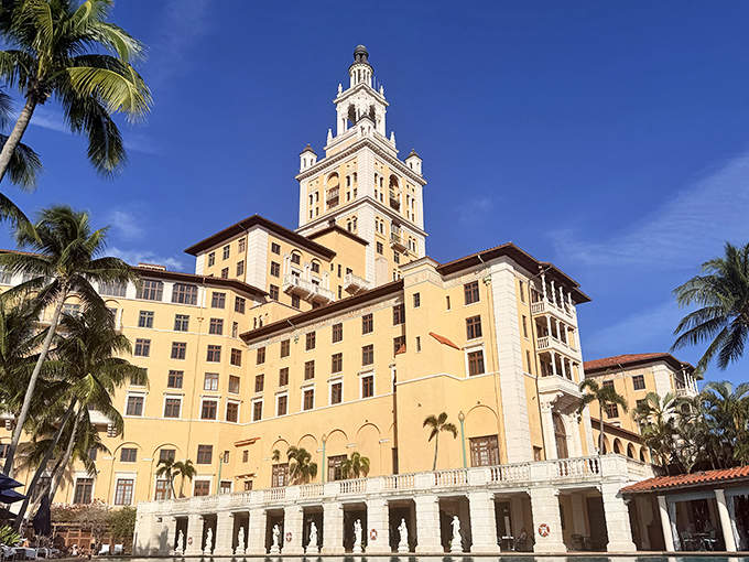 The Biltmore's impressive silhouette stands tall against the blue Florida sky, its Spanish-inspired architecture a landmark in Coral Gables.