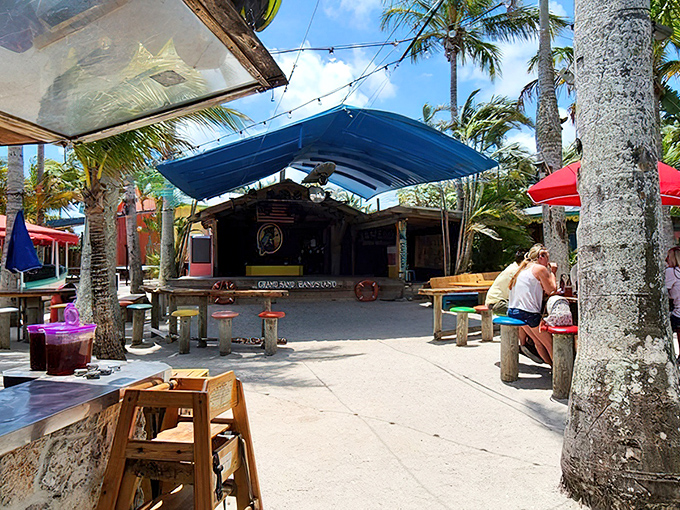 Island escape without leaving Florida – Captain Hirams’ palm-shaded seating, sandy floors, and colorful umbrellas create the perfect laid-back, barefoot dining experience.